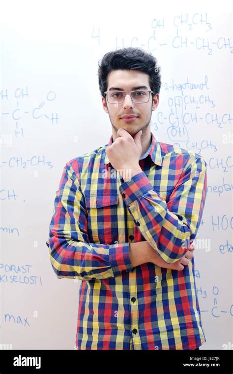 Happy Young Teenage Boy Portrait In School On Chemistry Classes And