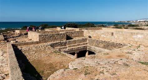 Tombs Of The Kings In Paphos Cyprus With Tourists Viewing Ancient