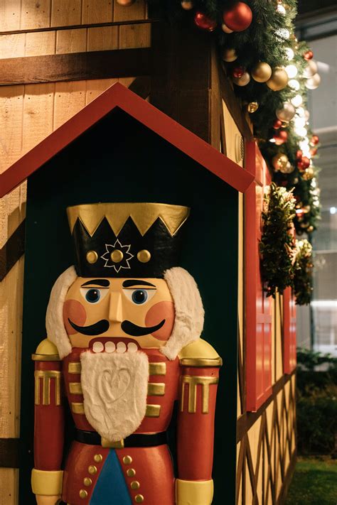 A Large Nutcracker Statue Sitting In A Doorway Photo Free Nutcracker
