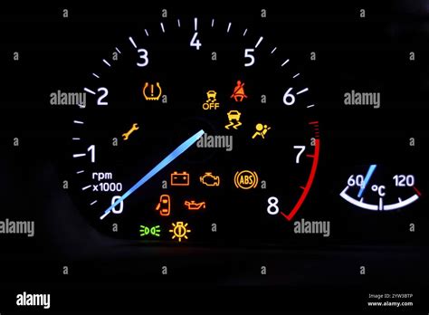A Car S Dashboard Lights Up With Multiple Alert Icons Signaling