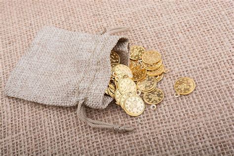 Numerous Counterfeit Gold Coins Are Visible In The Scene Photo Background And Picture For Free