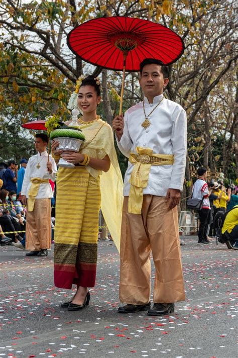 Picture Of Thai Youth Wear Thai Lanna Traditional Clothing On A Street Parade For Flower