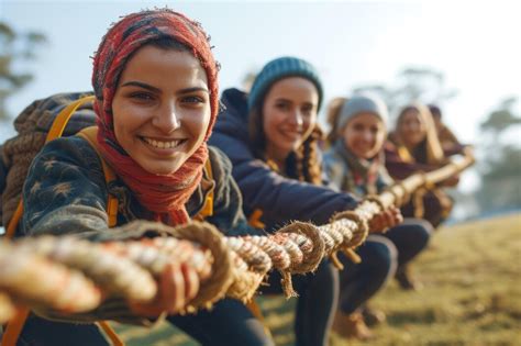 Premium Photo Women Of Diverse Backgrounds Pulling A Rope Together
