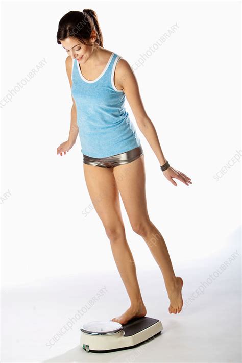 Woman Standing On A Scale Stock Image C0326689 Science Photo Library