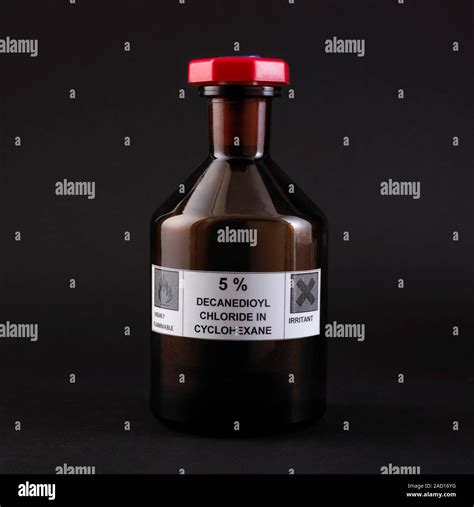 A Bottle Of Decanedioyl Dichloride Also Known As Sebacoyl Chloride
