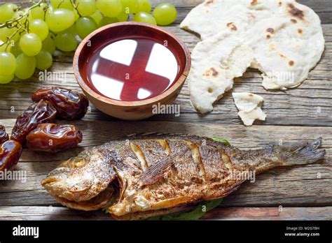 Easter Food With Fish Passover Bread Cross In Goblet Of Wine Last