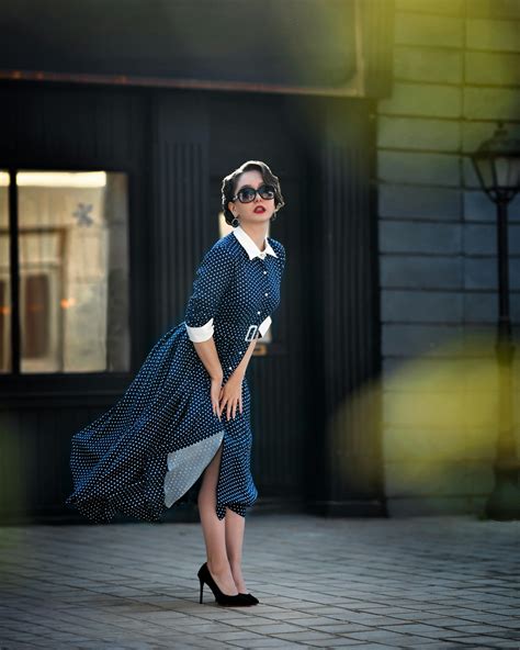 Woman In Black And White Polka Dot Dress Sitting Beside Pavement · Free