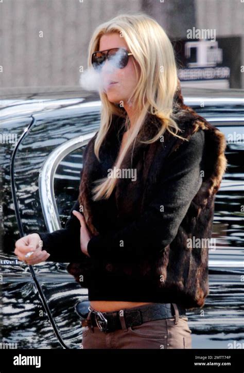 Exclusive Actress Tara Reid Wears A Fur Vest Black Top And Brown