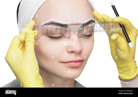 Permanent Make Up For Eyebrows Of Beautiful Woman With Thick Brows In Beauty Salon Closeup