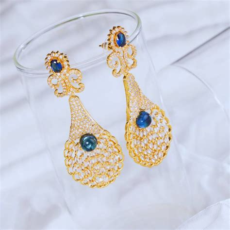 Gold Plated Lattice Teardrop Earrings With Blue Cabochon Stone
