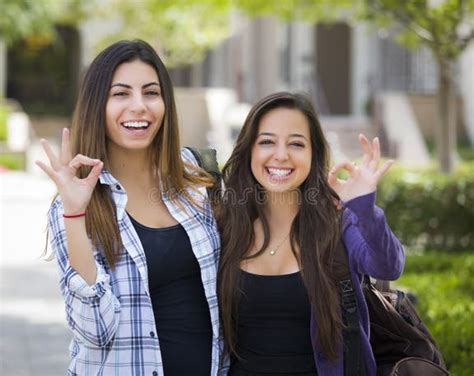 Happy Same Sex Mixed Race Couple On School Campus With Okay Sign Stock