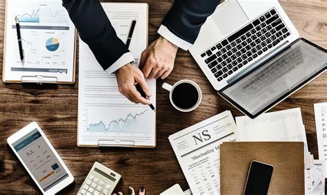 A Worker Analyzing Using Graphs Premium Ai Generated Image