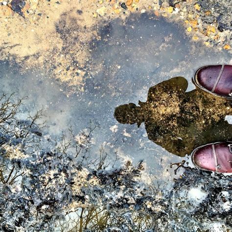 Premium Photo Reflection Of Man In Puddle