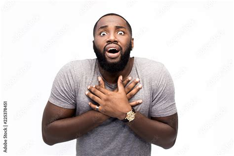 Portrait Of Shocked Black Shocked Surprised Man Looks Bugged Eyes And Rounded Mouth Being