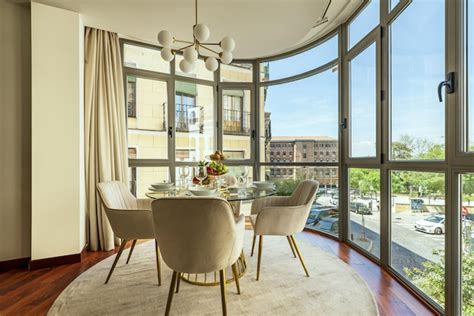 Premium Photo Glass Dining Table Placed In A Room With A Beautiful Glass
