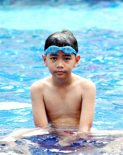 Premium Photo Portrait Of Boy In Swimming Pool