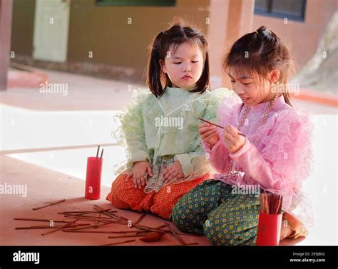 Cute Young Asian Girls In Traditional Thai Costumes Are Shaking Chi Chi
