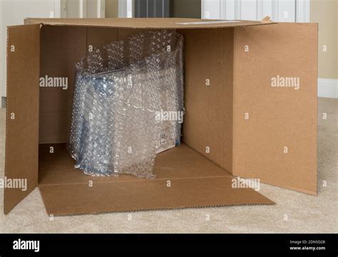 Humorous Photo Of A Small Boxed Product Surrounded By Bubble Wrap In A Large Almost Empty