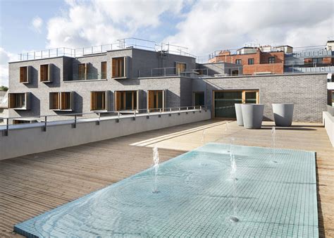 Michel Guthmann Pairs Grey Brick With Larch For Paris Housing Block