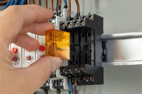 Inserting Relay Into Electrical Control Panel Stock Image Image Of