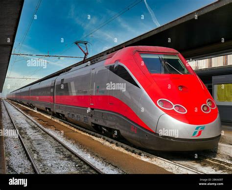 The Engine And Carriages Of A Trenitalia National Rail Operator Italy