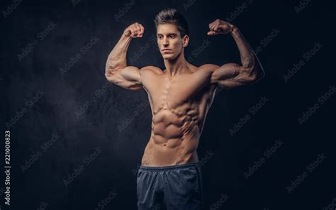 Handsome Shirtless Man With Stylish Hair And Muscular Ectomorph Shows
