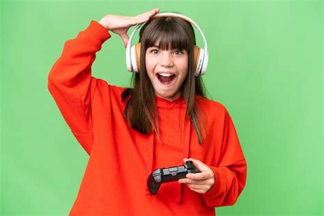Premium Photo Little Caucasian Girl Playing With A Video Game Controller Over Isolated