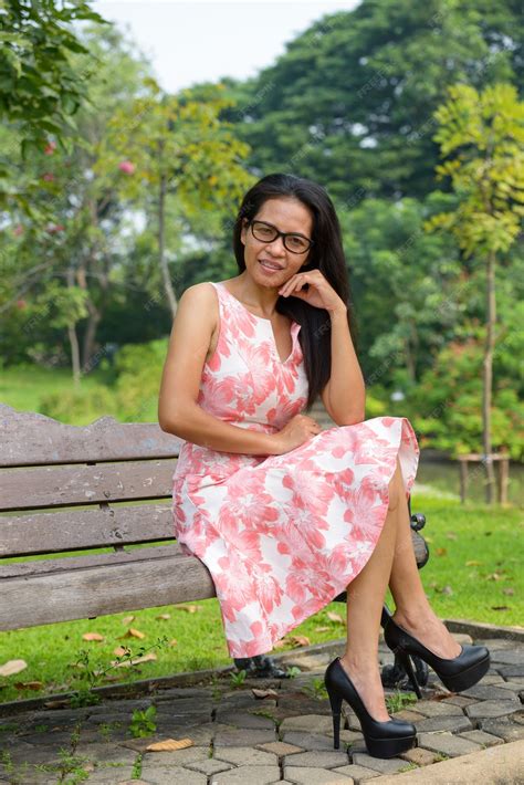 Premium Photo Portrait Of Mature Asian Woman Relaxing At The Park