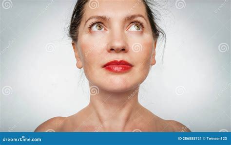 Close Up Portrait Of Middle Aged Woman Captured In Wide Angle