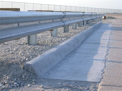 Crash Analysis And Evaluation Of Vehicular Impacts On W Beam Guardrails Placed Behind Curbs