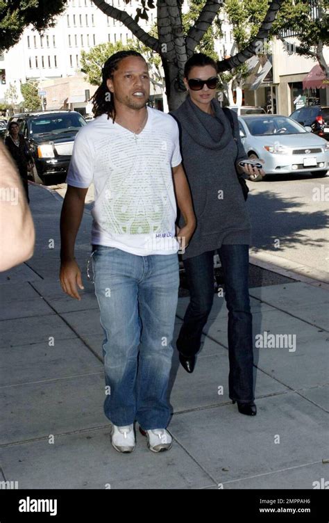 Los Angeles Galaxy Soccer Star Cobi Jones And A Friend Enjoy A Stroll