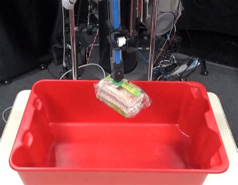 A The Robot Grasped Small Objects Such As Brown Sponge With One Arm