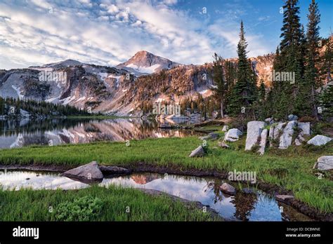 First Light On Ne Oregons Eagle Cap Reflecting Into Mirror Lake In The