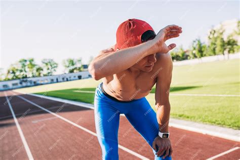 Premium Photo Caucasian Athlete Male Relaxing Topless After Intense