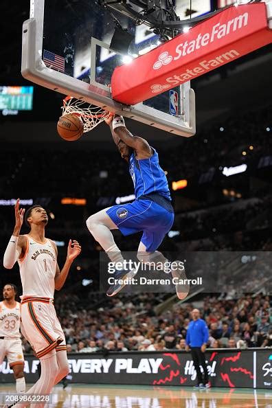Kyrie Irving Of The Dallas Mavericks Dunks The Ball During The Game