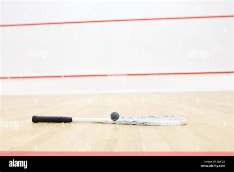 Racket And Ball For Squash Game Racquetball Equipment On The Court And