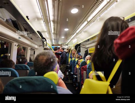 Crowded Packed Southern Rail Train Carriage With Passengers Having To