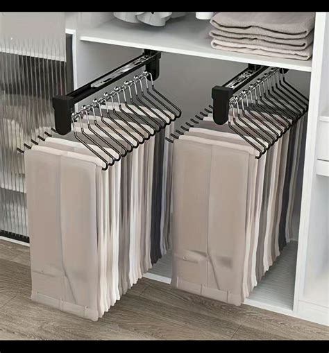 Open Closet With Hanging Clothes And Folded Towels Closet Organizer