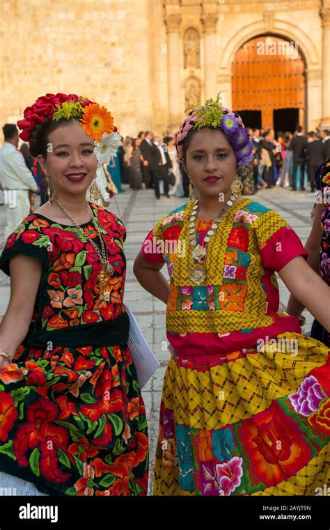 Women Posing Dressed In Regional Costumes In The City Of Oaxaca De
