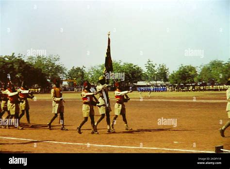 soldiers carrying their regimental colours on parade on independence