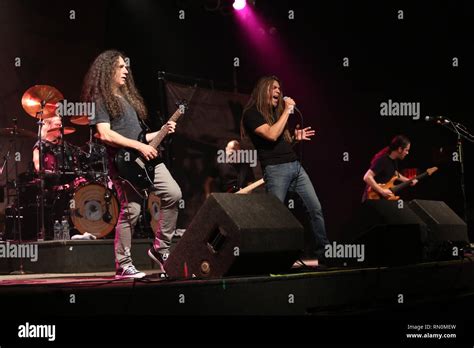Fates Warning Are Shown Performing On Stage During A Live Concert