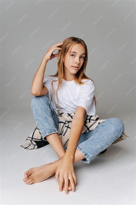 Premium Photo Portrait Of A Barefoot Teenage Girl Sitting Cross