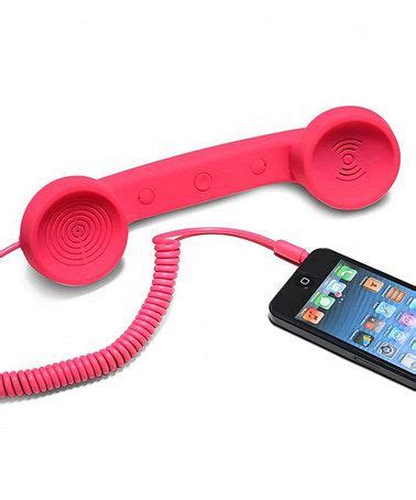 A Pink Phone Is Plugged In To A Cord
