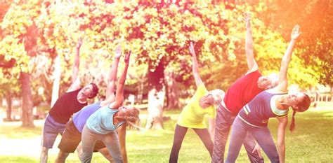 Premium Photo Fitness Class Stretching In The Park