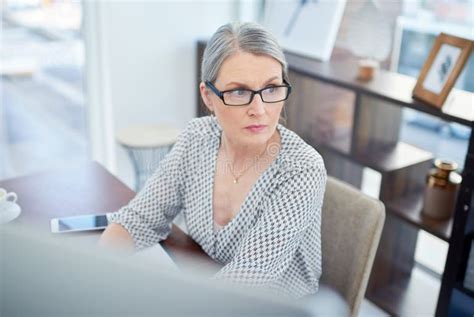 Woman Glasses And Thinking On Computer For Business Error Or Mistake In Company Tax For Audit