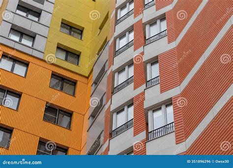 Angled View Of A Modern Building Facade With Orange Cladding And