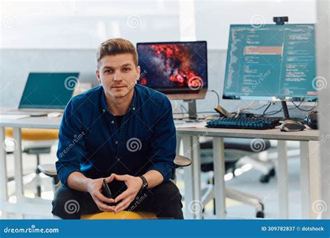 Programming Man Working On Computer In It Office Sitting At Desk