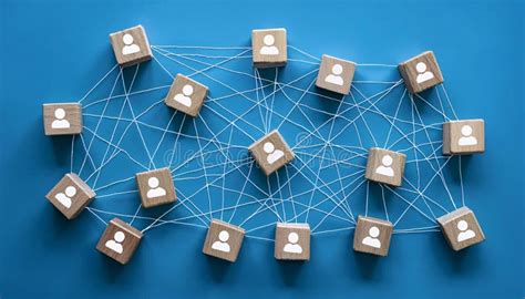 A Network Of Wooden Blocks With Person Icons Connected By Glowing Lines