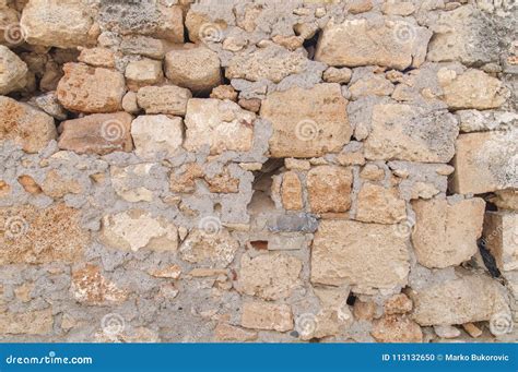 Samlles Pattern Of Aged Castle Wall Stone Texture In The Greek Town Royalty Free Stock Image