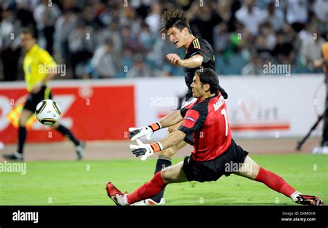 Germanys Mario Gomez Back And Azerbaijans Goalkeeper Kamran Agayev Vie For The Ball During